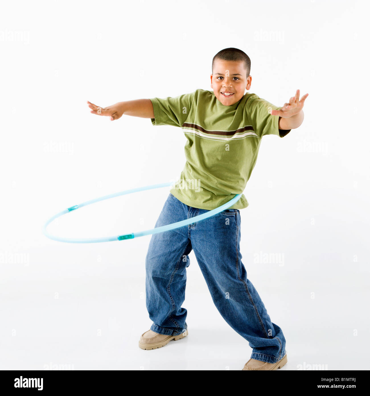 Young latino adolescent boy using hula hoop Stock Photo - Alamy
