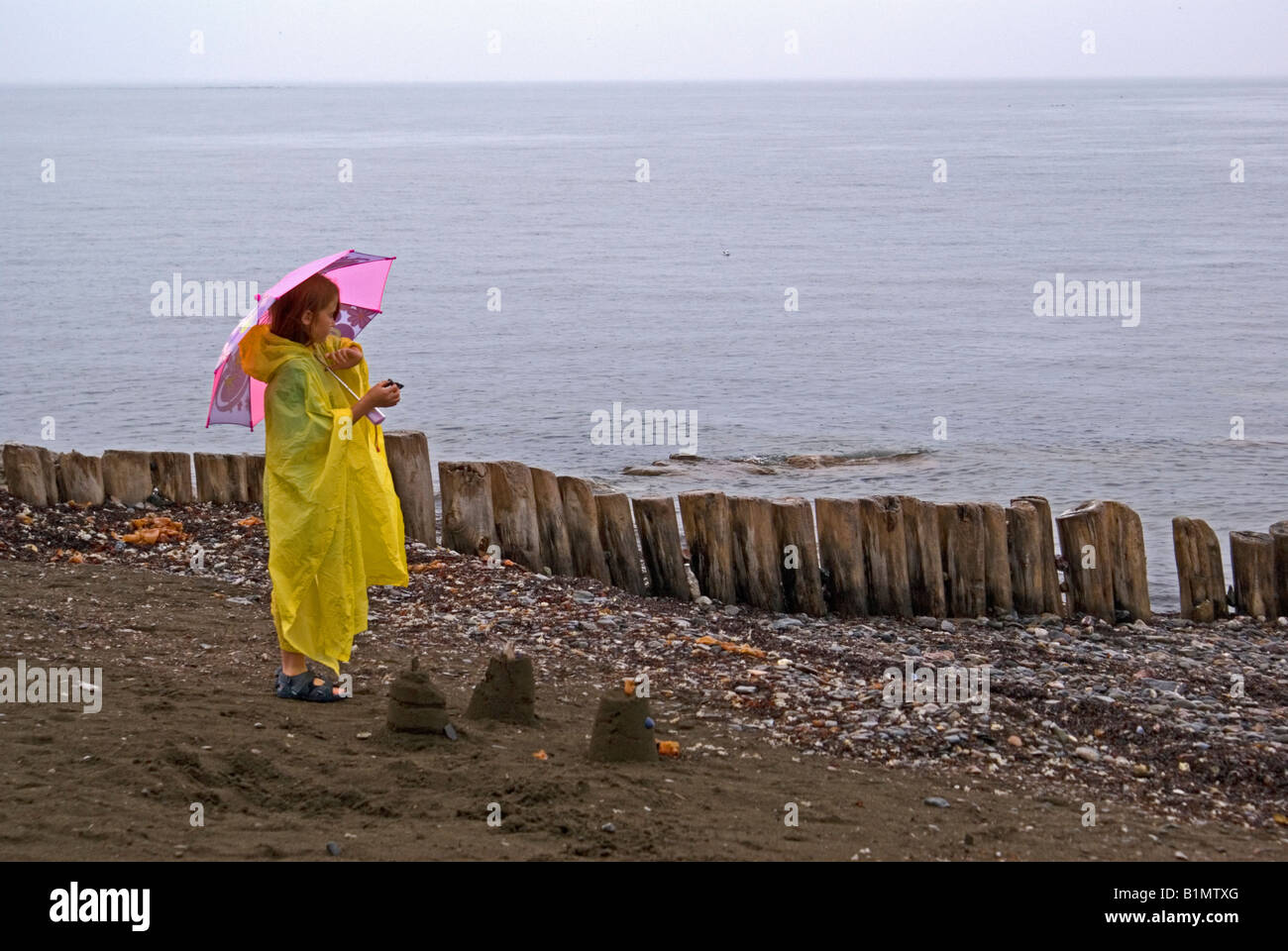 Beach umbrella rain hi-res stock photography and images - Alamy