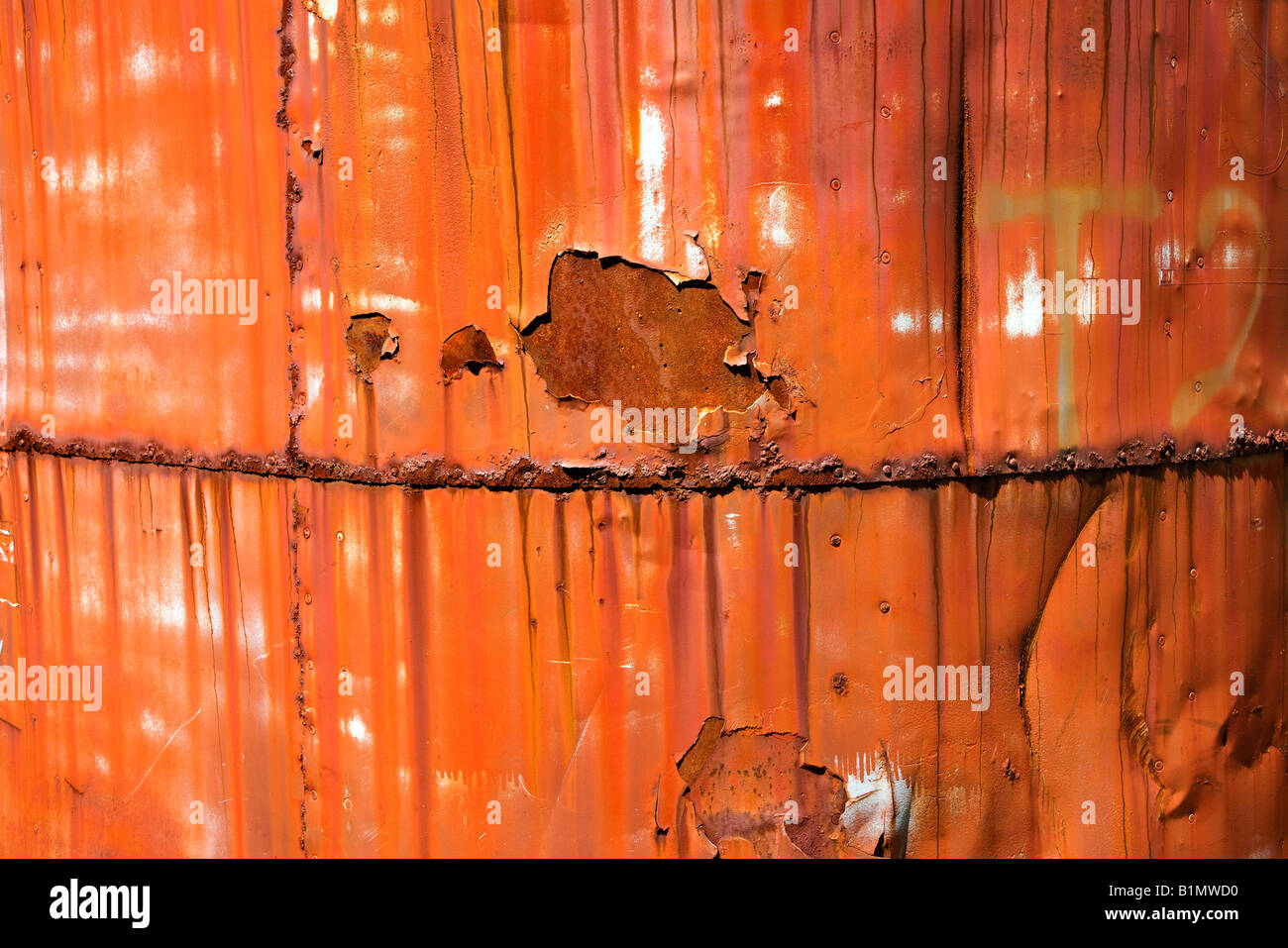 Closeup of metal orange container Stock Photo - Alamy