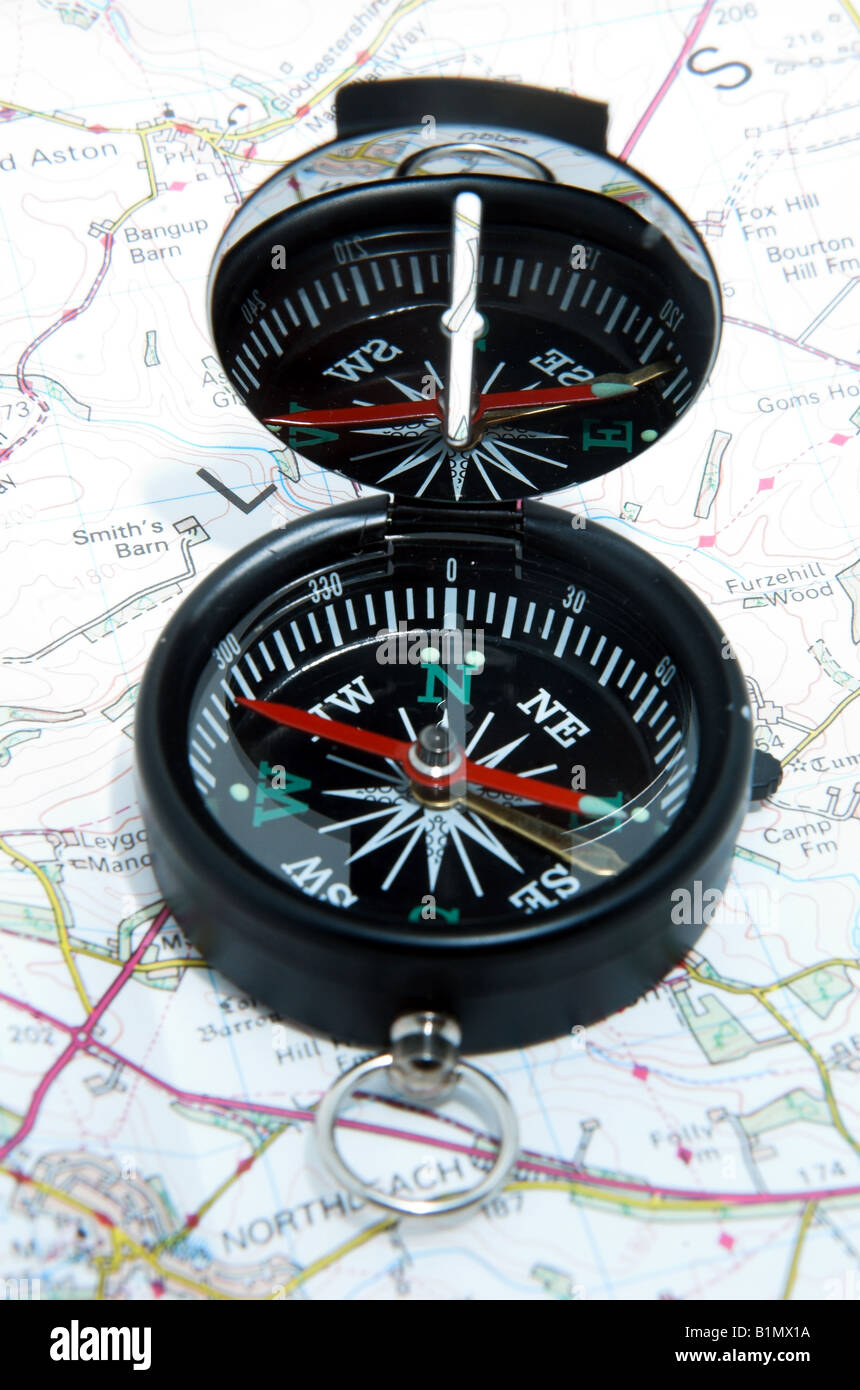 black compass resting on map Stock Photo - Alamy
