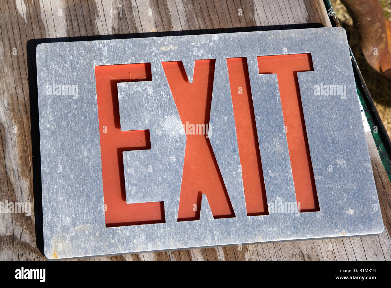 Old exit sign lying on wood Stock Photo - Alamy