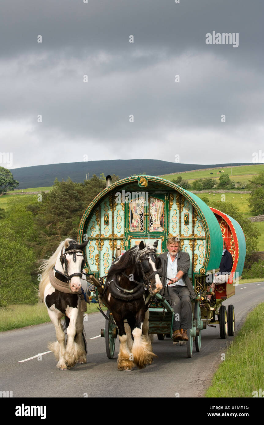 Horse drawn caravan on the road heading to Appleby horse fair On A683 ...