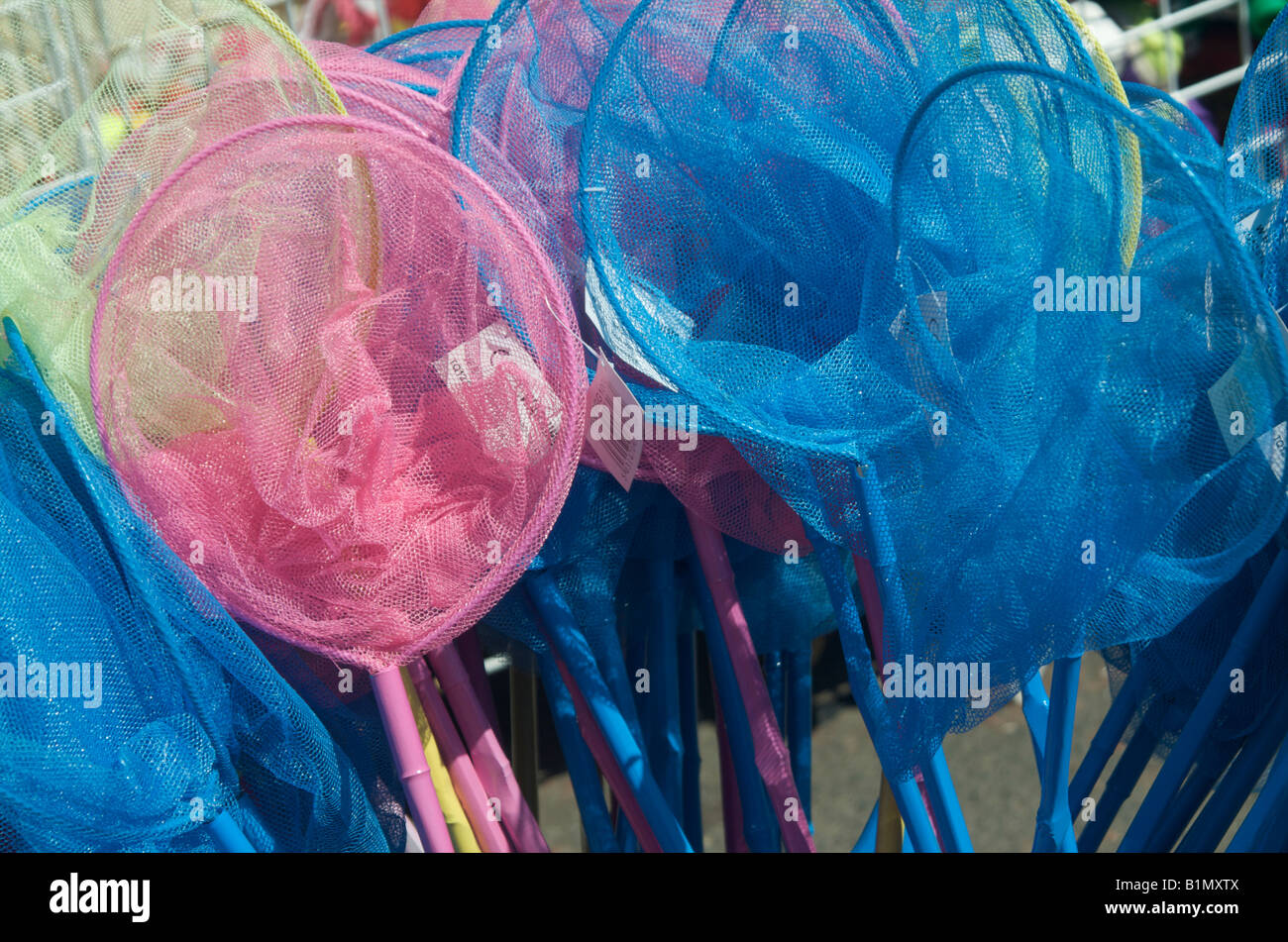 Colorful kids fishing nets Stock Photo - Alamy
