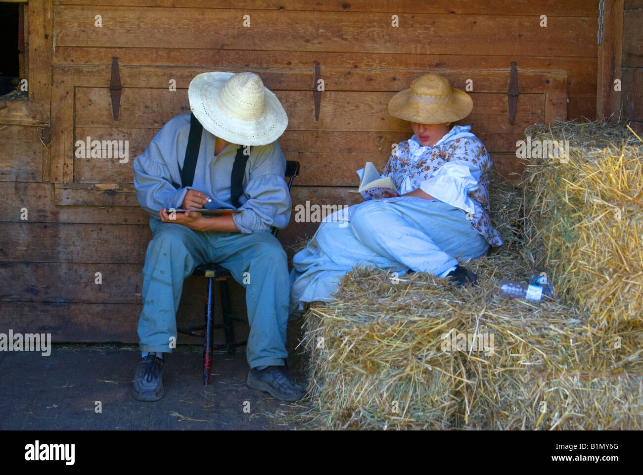 period character actors farm barn hay bale Stock Photo - Alamy