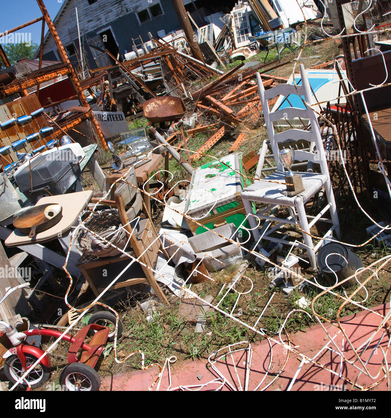 Chaotic mess of junk strewn across junkyard outdoors Stock Photo - Alamy