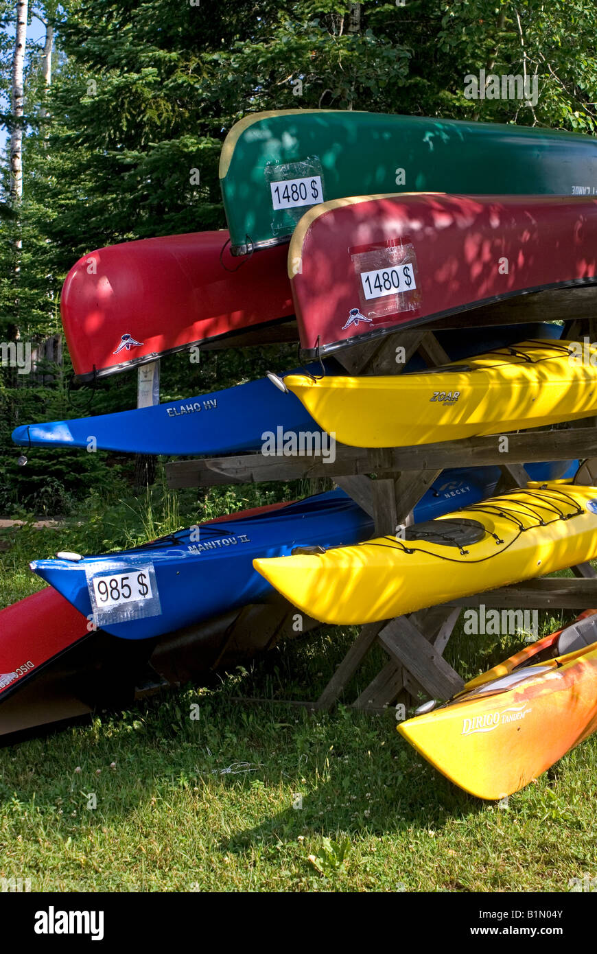 canoes kayaks stacked by Bonaventure River Quebec Stock Photo - Alamy