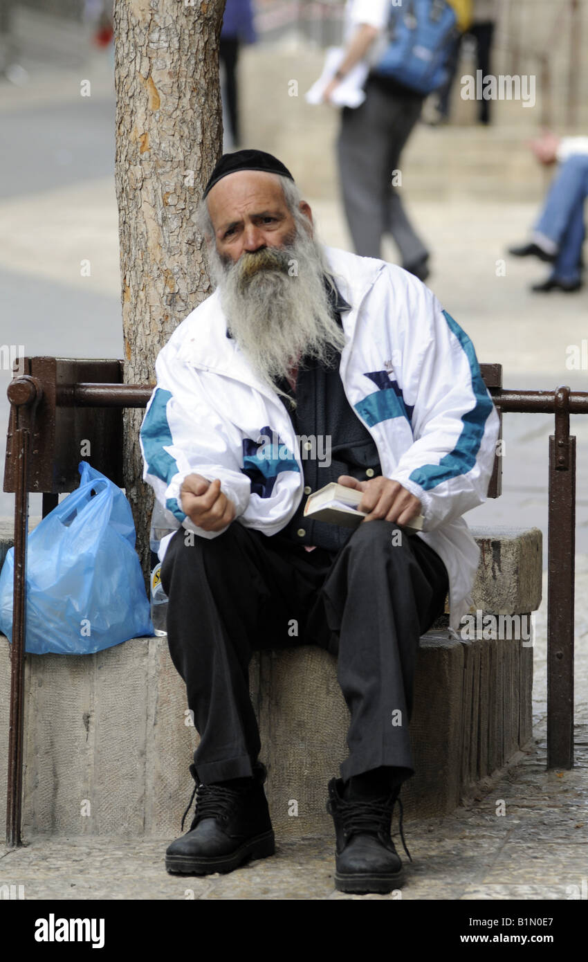 Portrait of an old Israeli man sitting on a public bench in Jerusalem ...