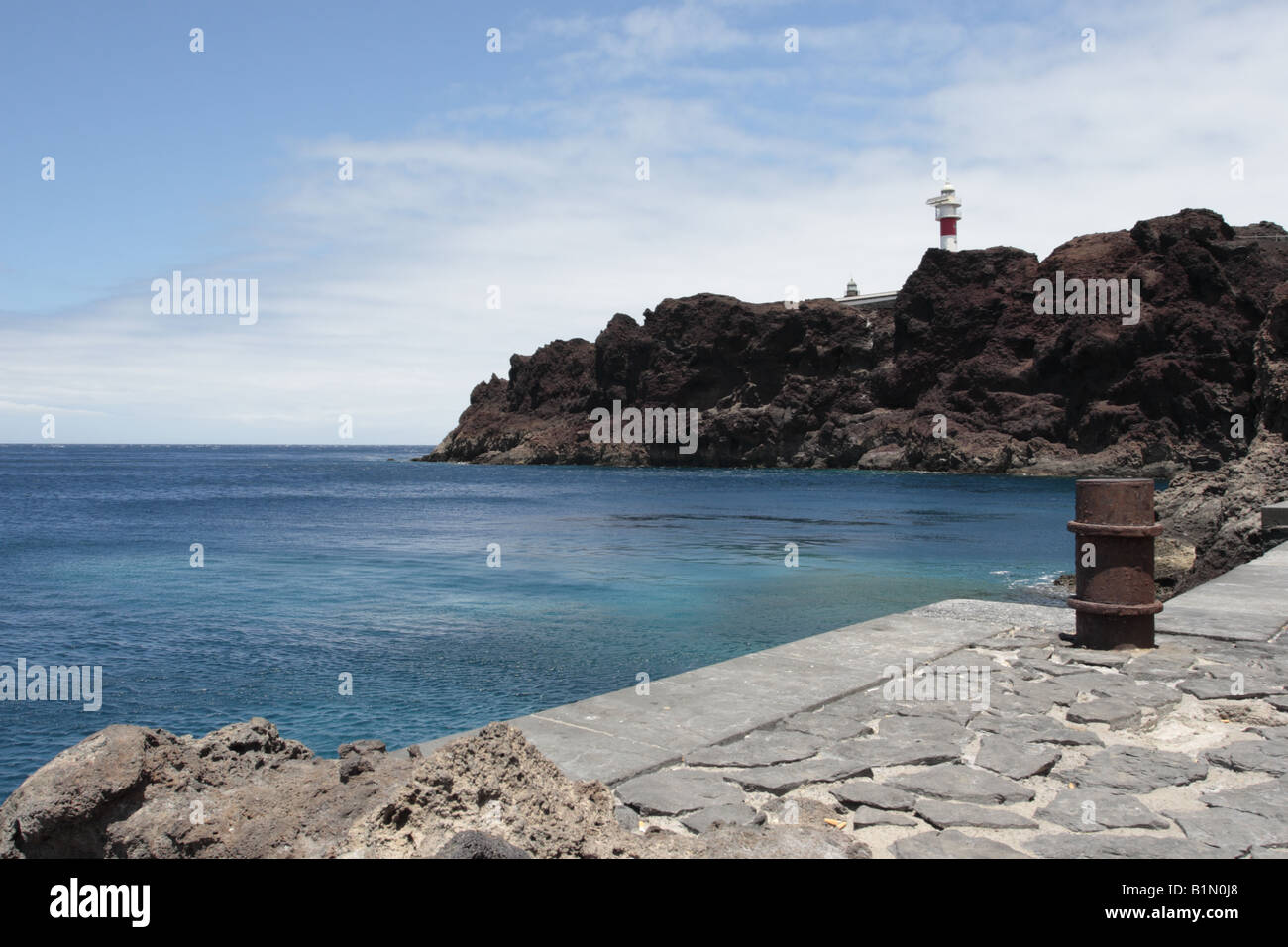 The small quay at Punto Teno and the old and modern lighthouses behind ...