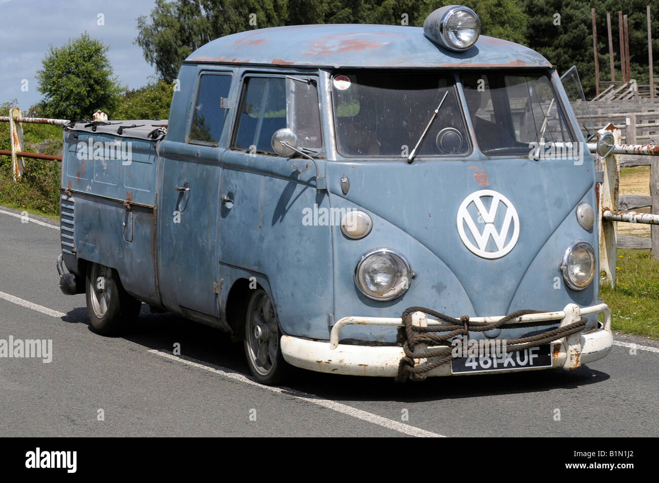 tatty looking Volkswagen crewcab travelling along New Forest road Stock ...