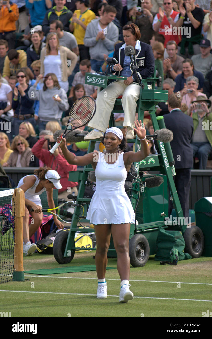 Serena Williams wave to the centre court crowd after winning her first ...