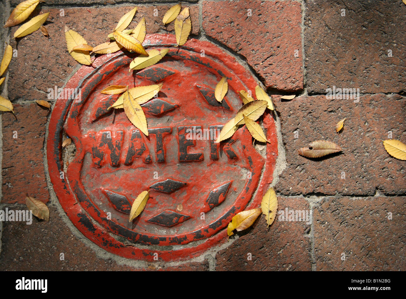 Water cap in a street of a city Stock Photo - Alamy