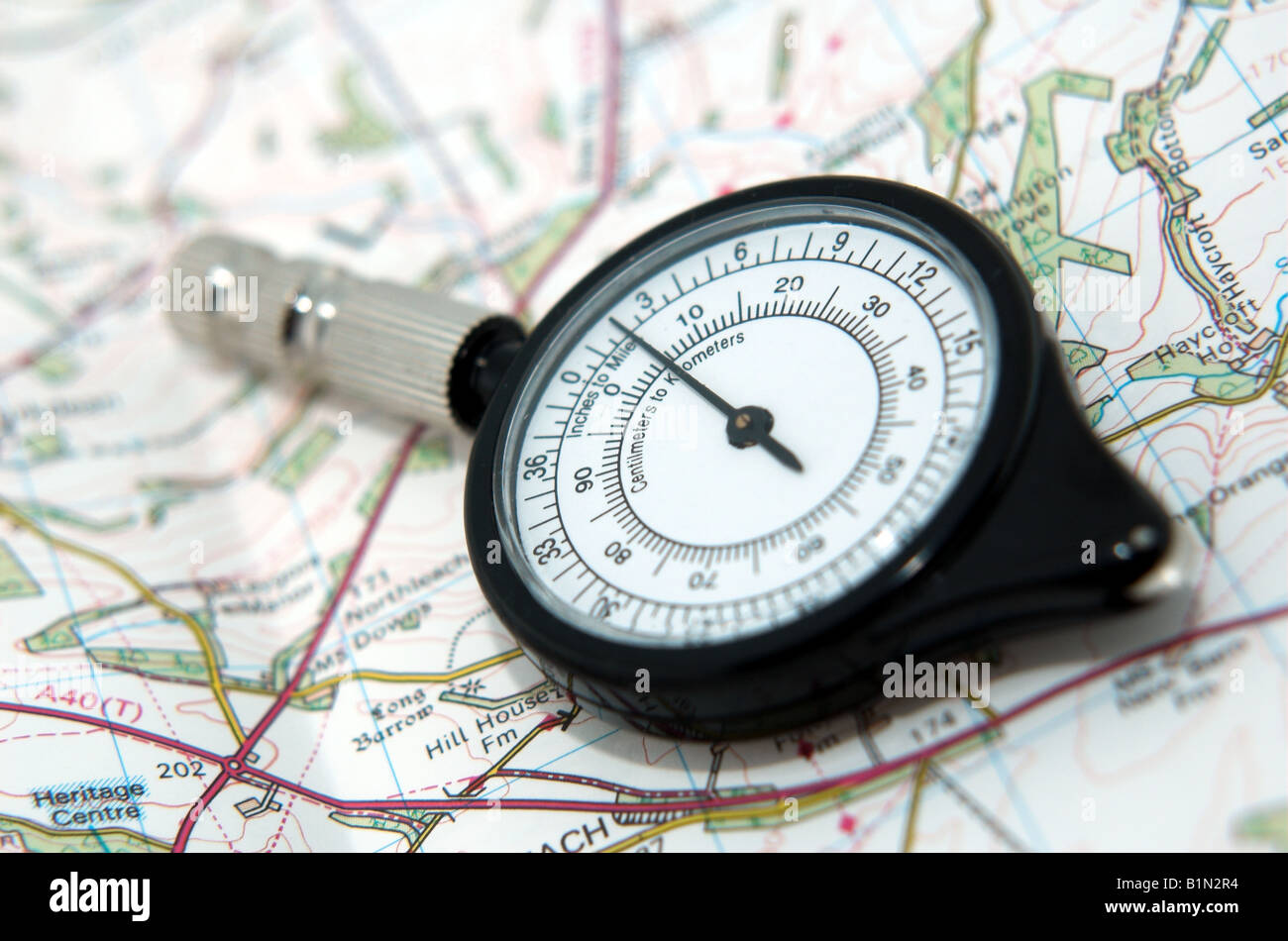 Map measurer resting on map Stock Photo - Alamy