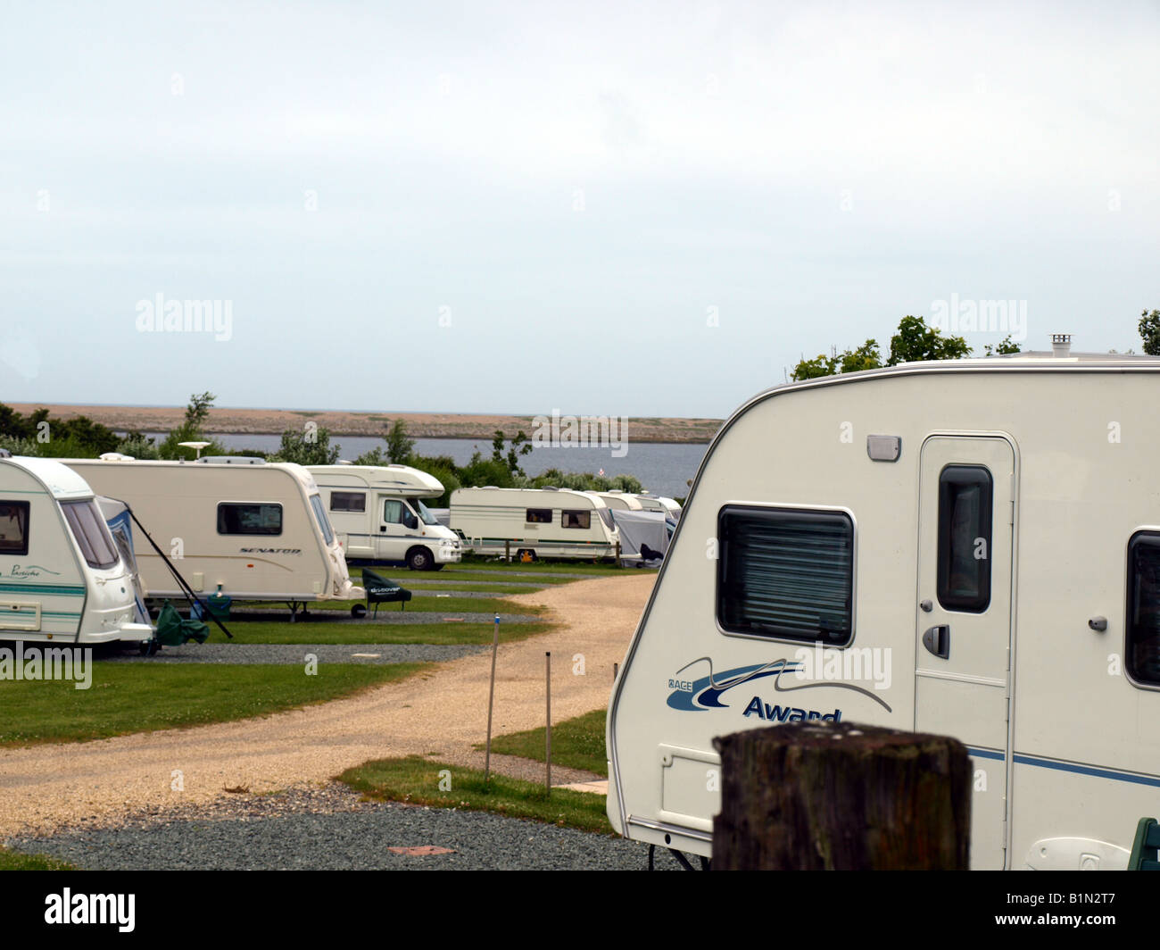The east fleet caravan park,with the fleet lagoon and chesil beach in ...