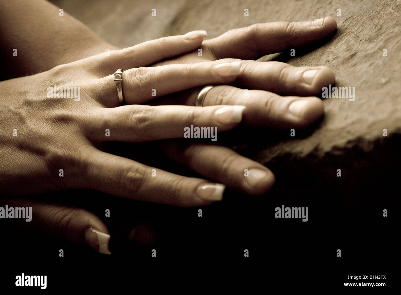 2 hands two rings one engagement ring Stock Photo - Alamy