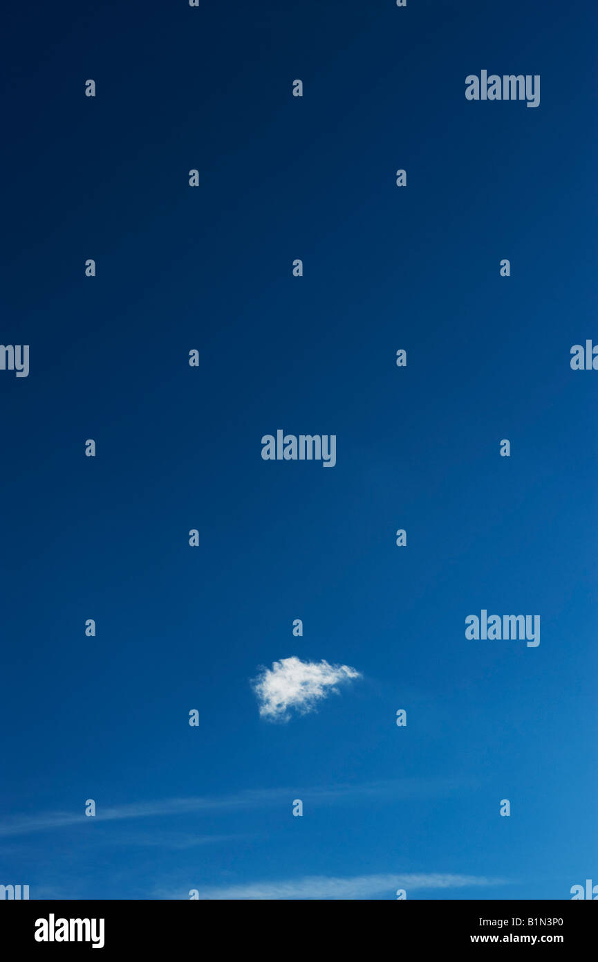 Single white puffy cloud in blue sky Stock Photo - Alamy