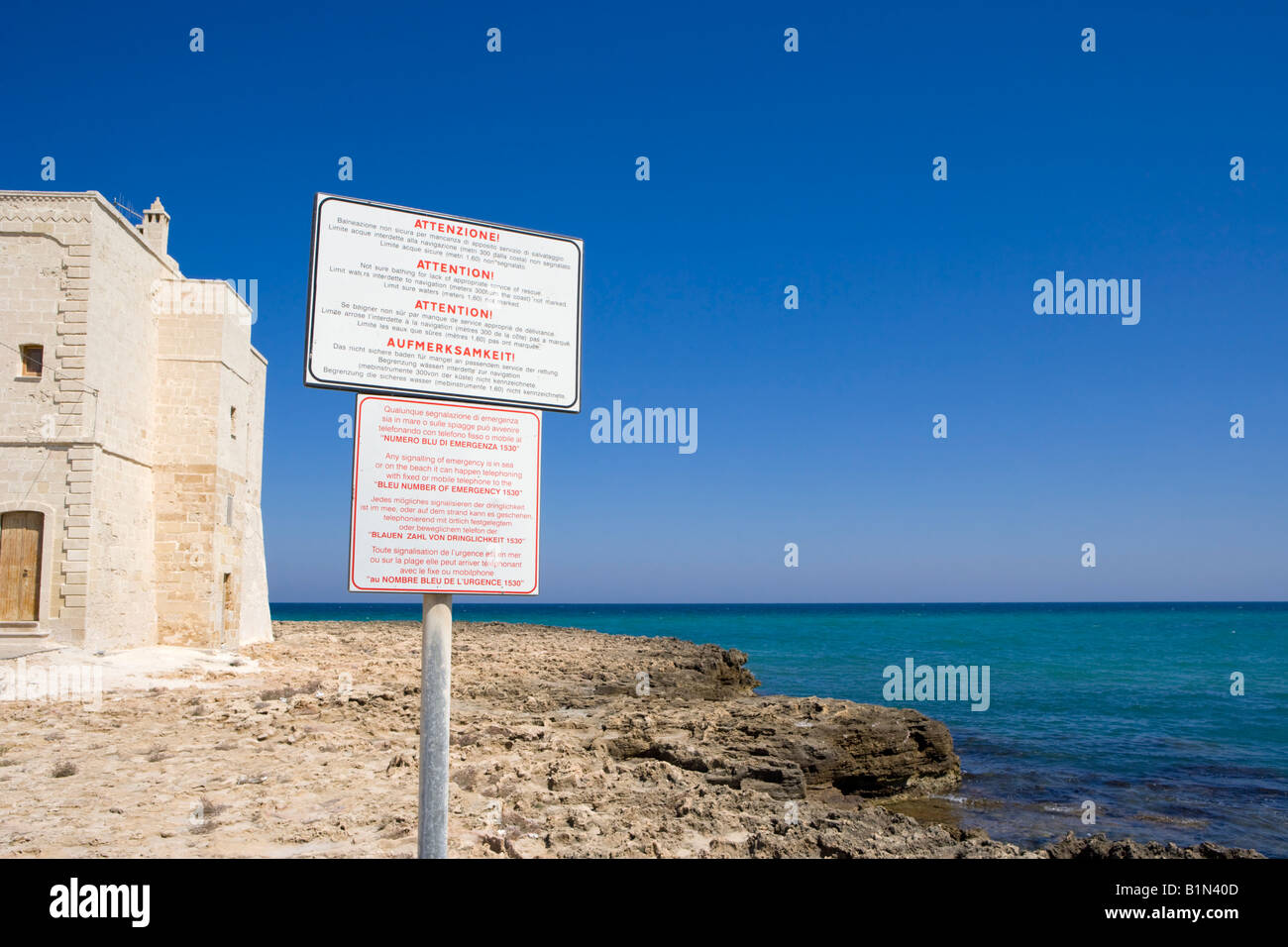 Beach emergency and swimming sign, Puglia, Italy Stock Photo - Alamy