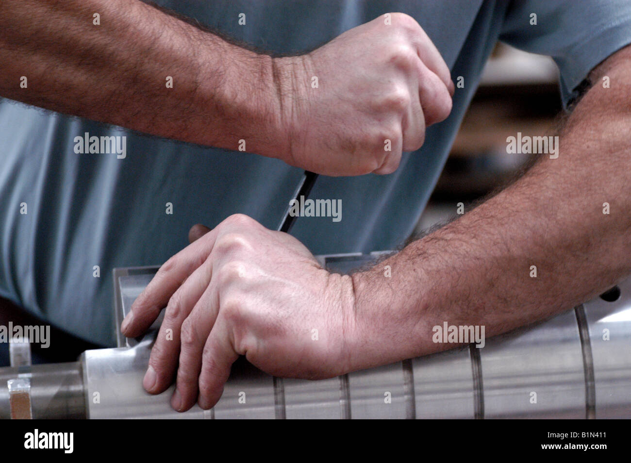 Man's hands while working Stock Photo - Alamy