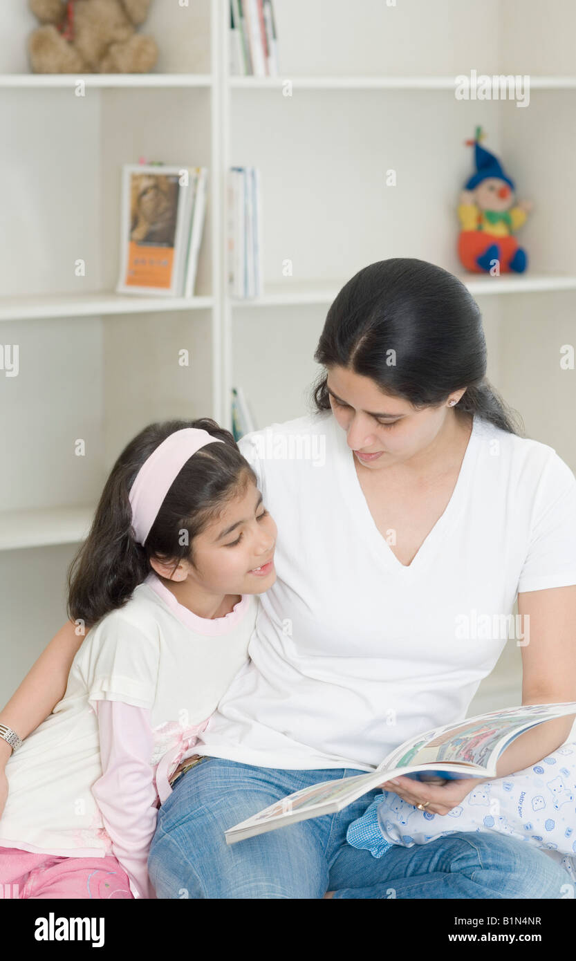 Indian mother teaching child hi-res stock photography and images - Alamy