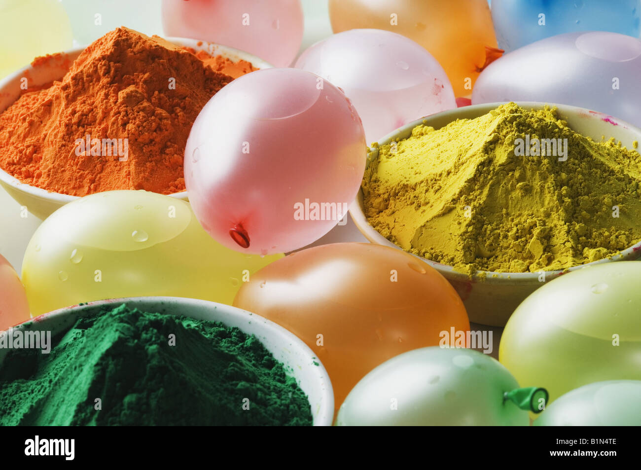 Close-up of water bombs and bowls of powder paint Stock Photo - Alamy