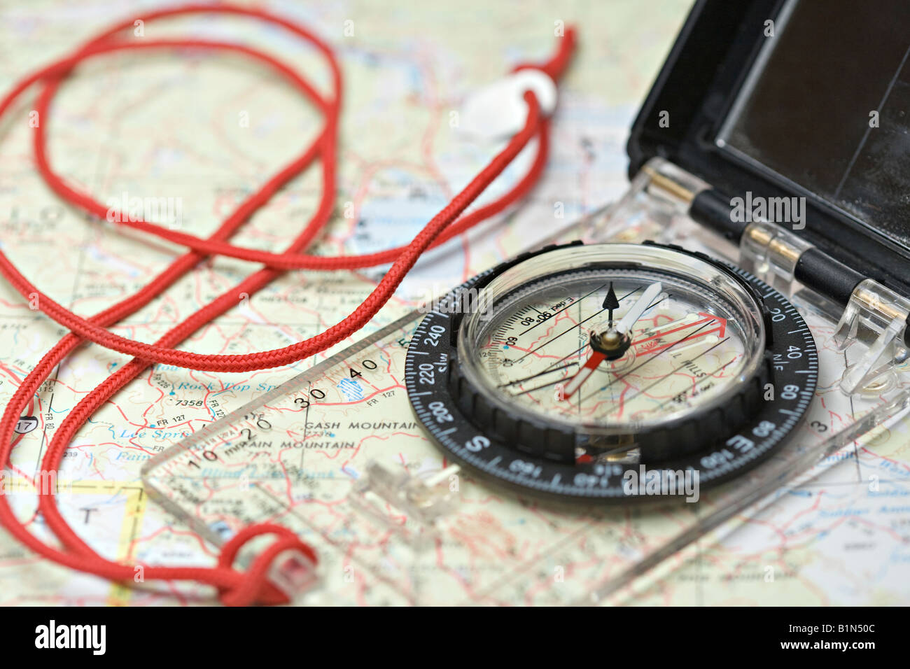 Compass resting on a map Stock Photo - Alamy