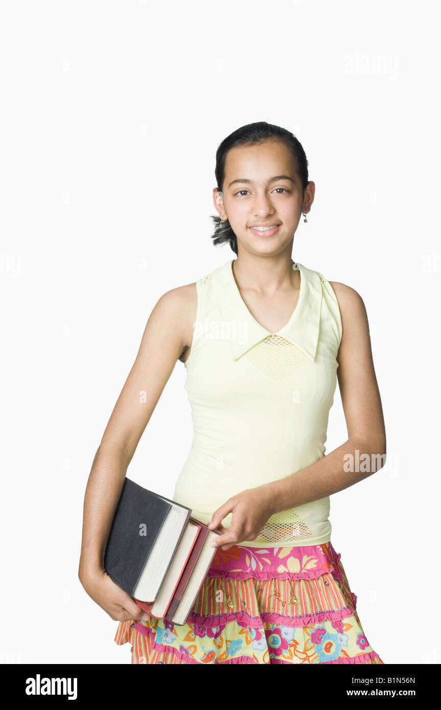 Portrait of a girl holding books Stock Photo - Alamy