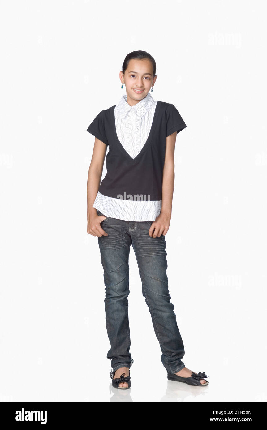 Portrait of a girl standing and smiling Stock Photo - Alamy