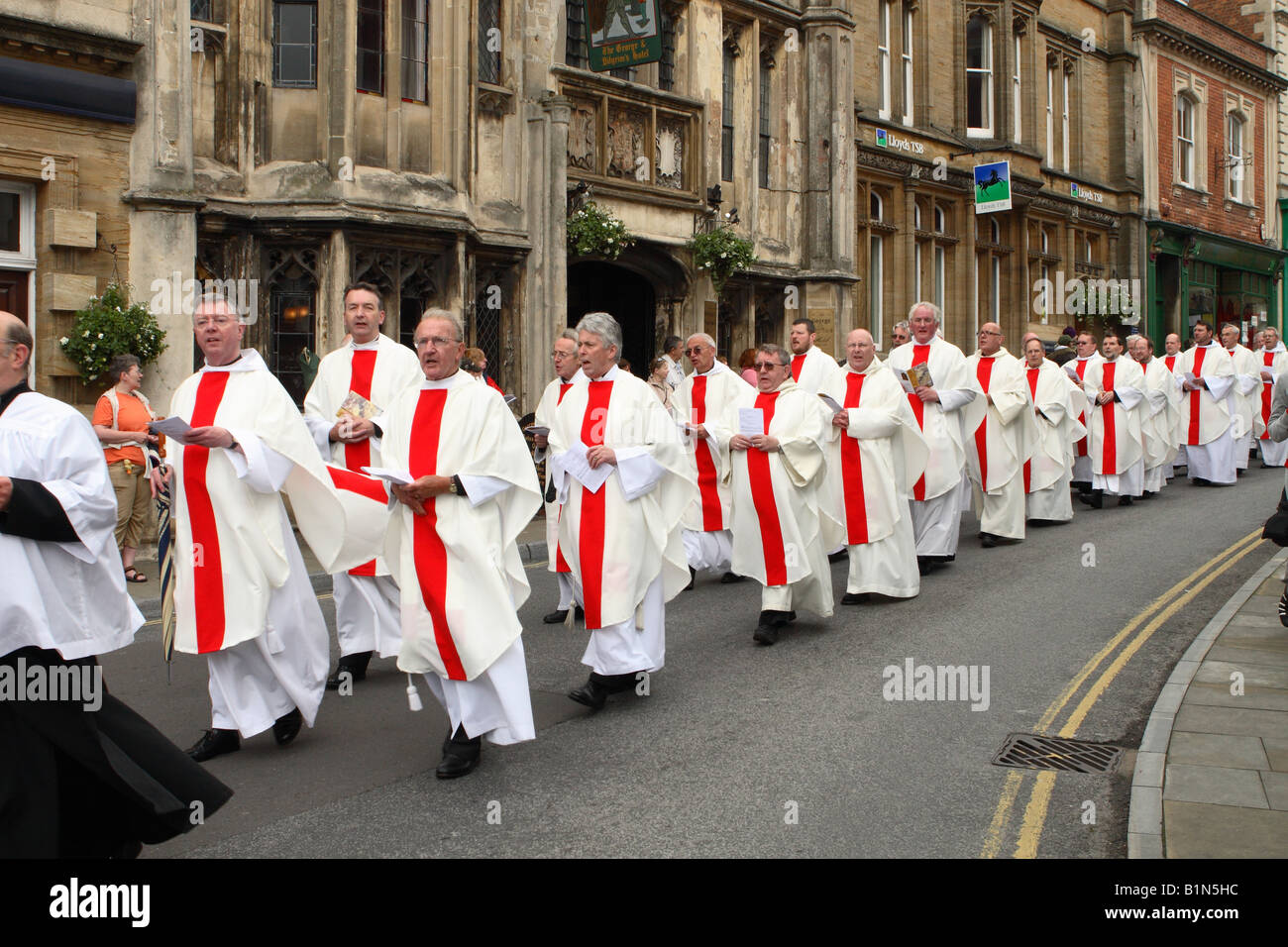The Glastonbury Pilgrimage christian procession clergy walk through ...