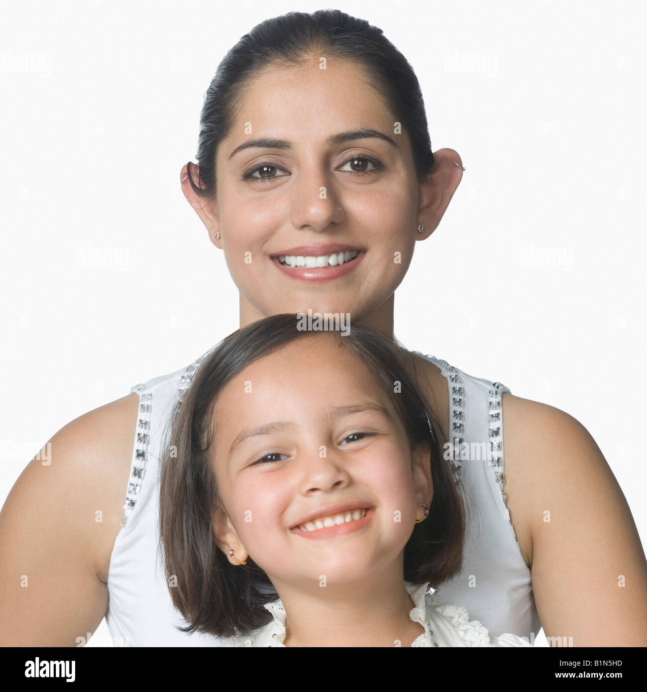 Portrait of a young woman and her daughter smiling Stock Photo - Alamy