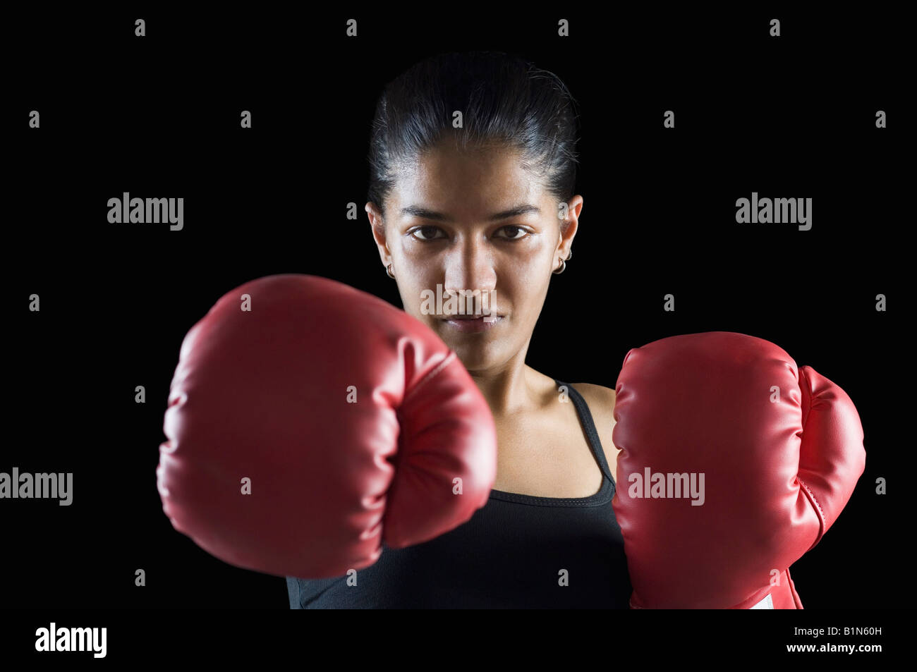 Portrait of a female boxer in boxing stance Stock Photo - Alamy