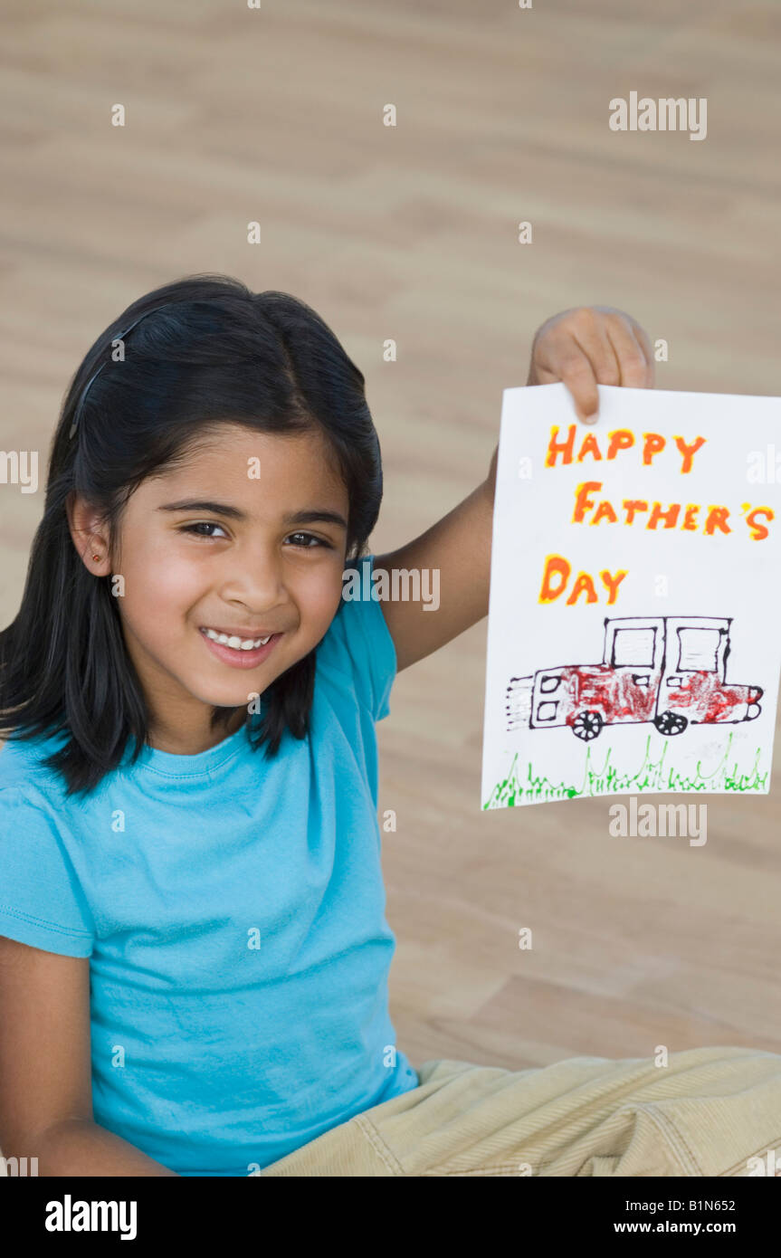 Portrait of a girl showing a greeting card Stock Photo - Alamy
