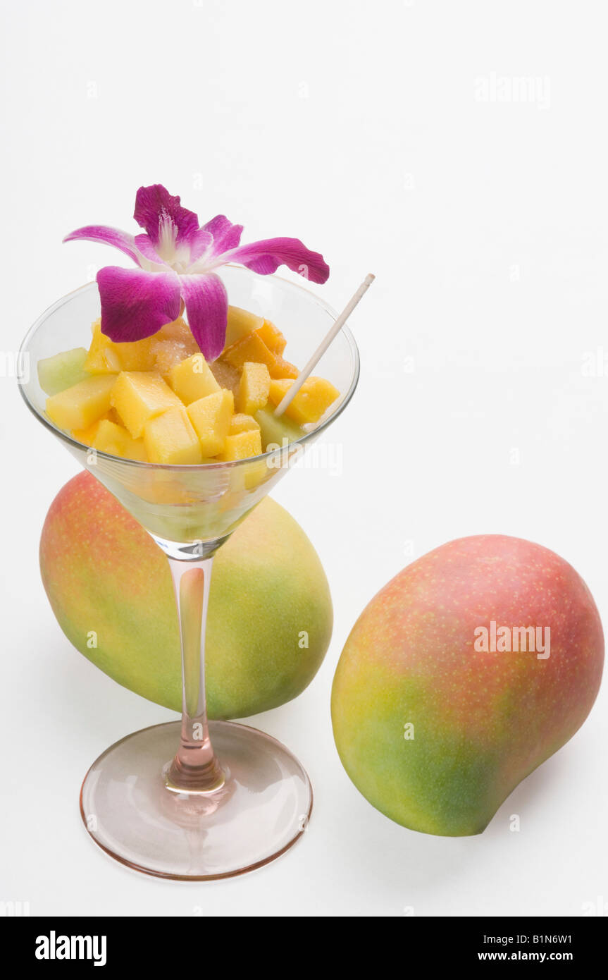 Close-up of a glass of mango slices and melon slices with mangoes Stock ...