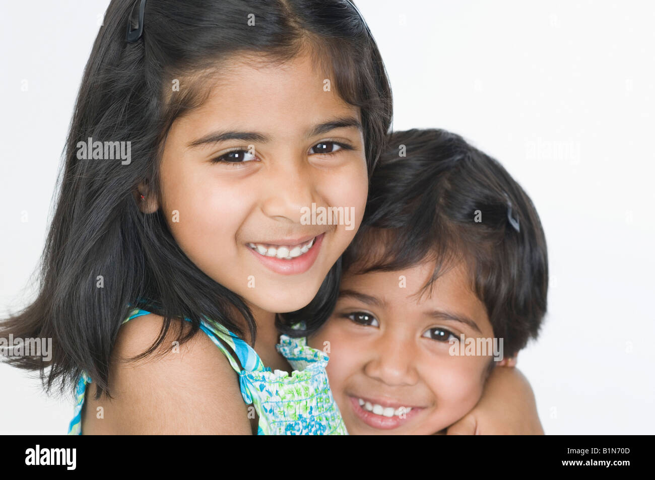 Portrait two indian girls hugging hi-res stock photography and images ...