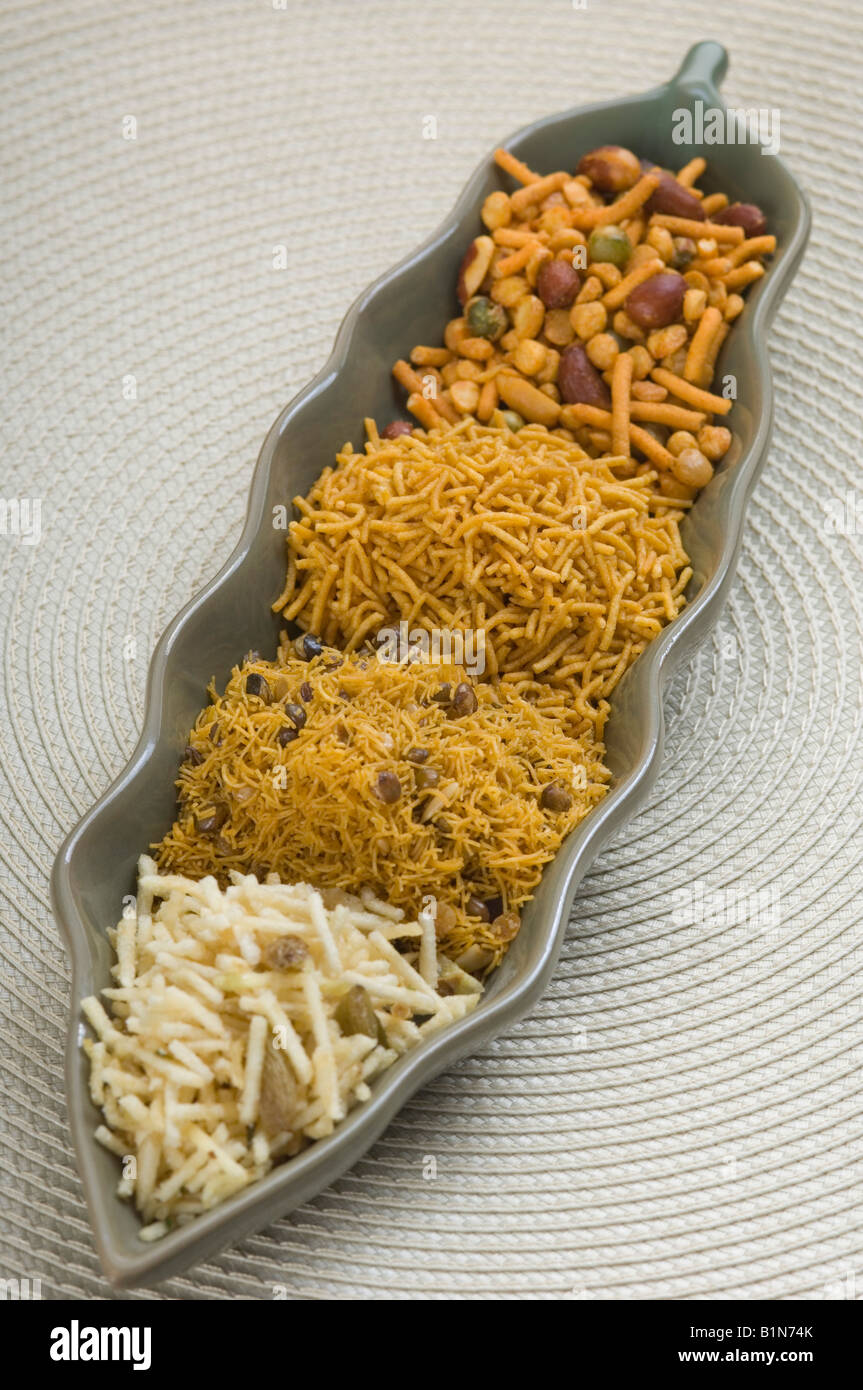 High angle view of various type of snacks in a tray Stock Photo - Alamy