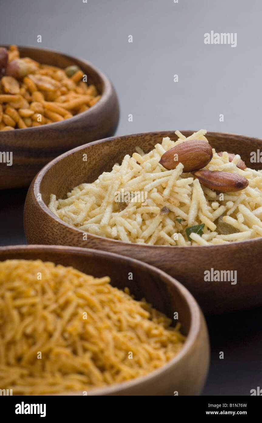 Close-up of various type of snacks in bowls Stock Photo - Alamy