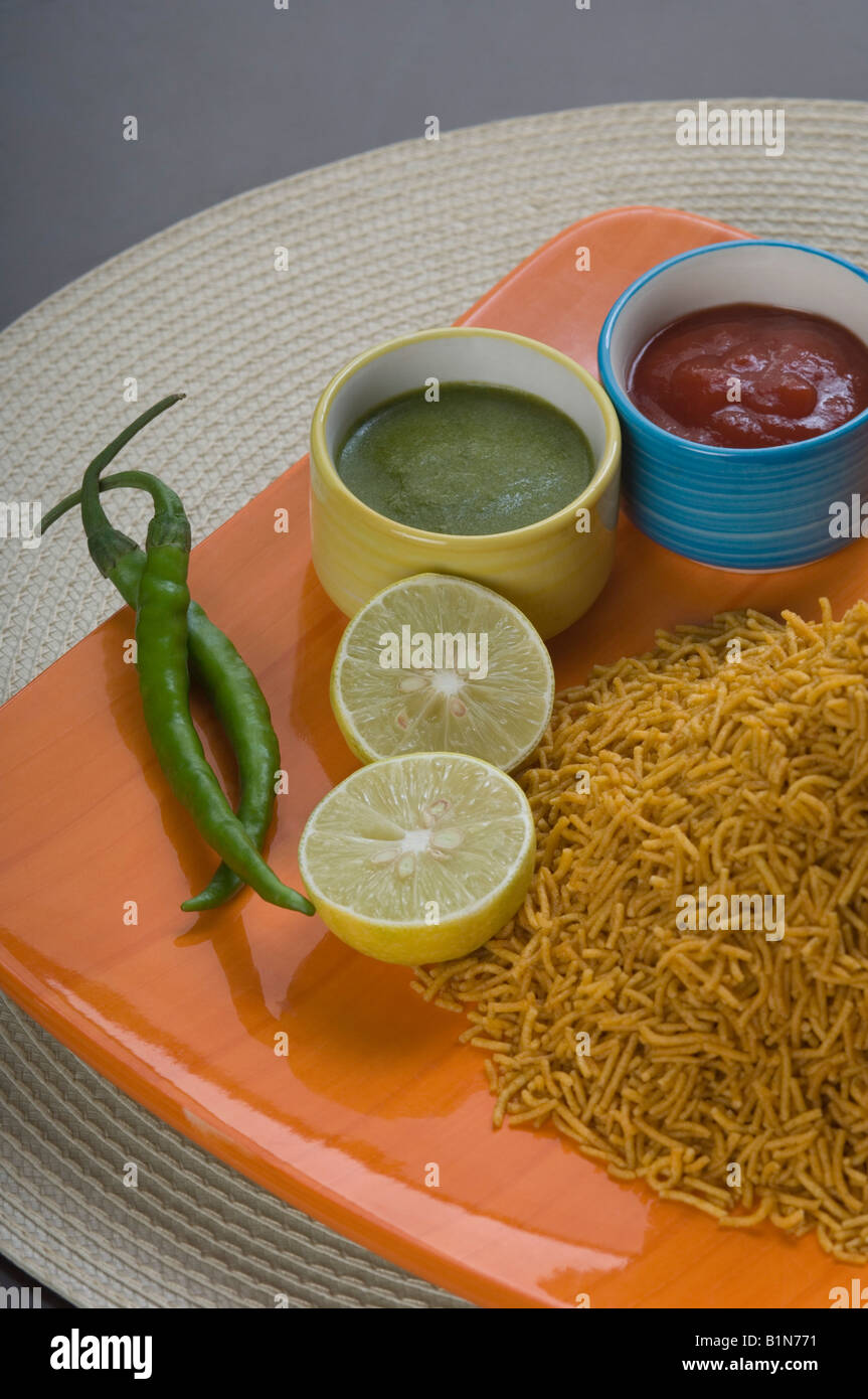 Close-up of snacks with sauce in a tray Stock Photo - Alamy