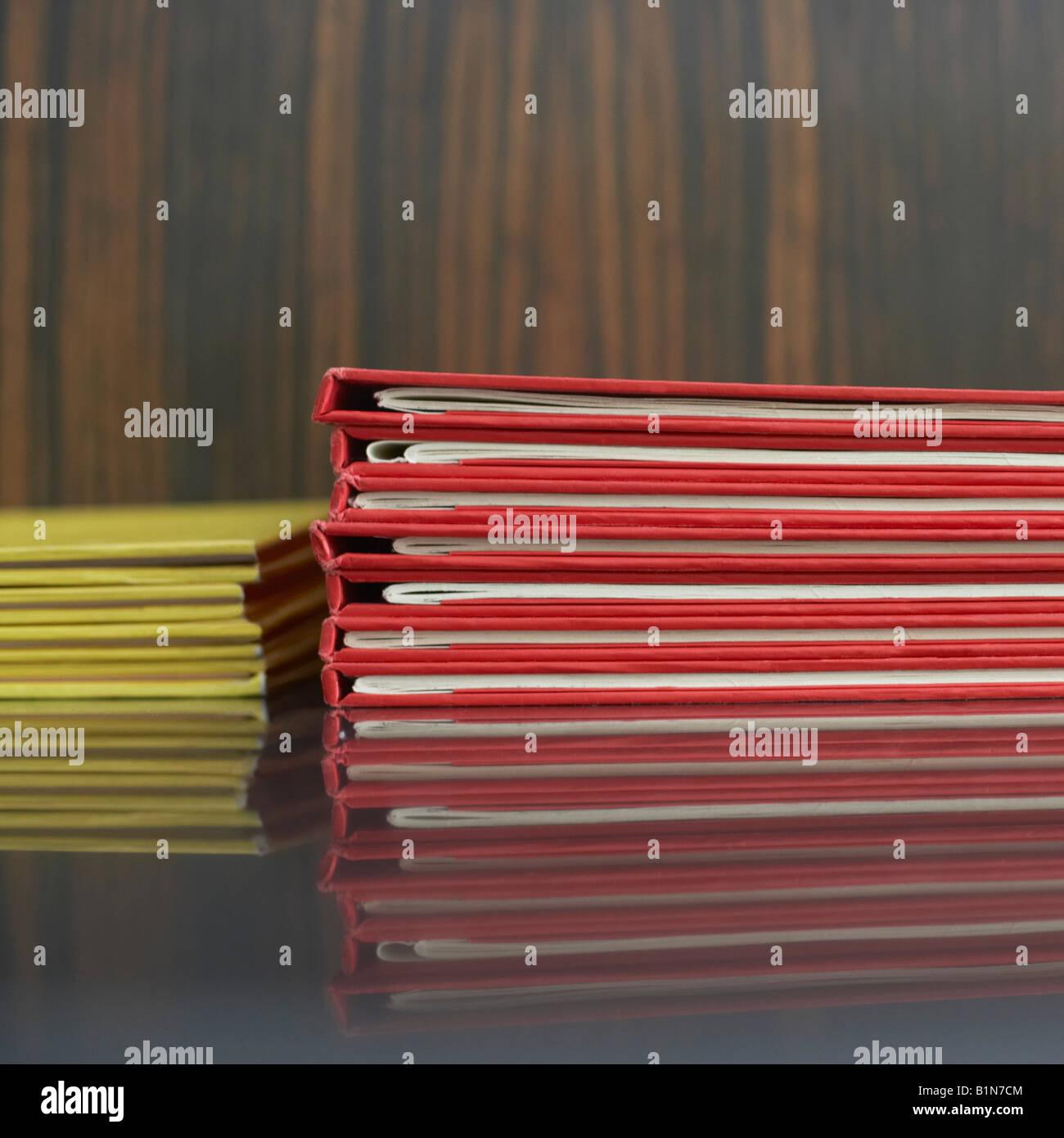 Reflection of a stack of files on a table Stock Photo - Alamy