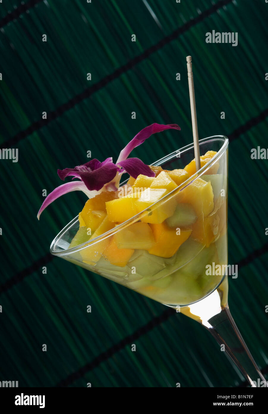 Close-up of a glass of mango slices and melon Stock Photo - Alamy