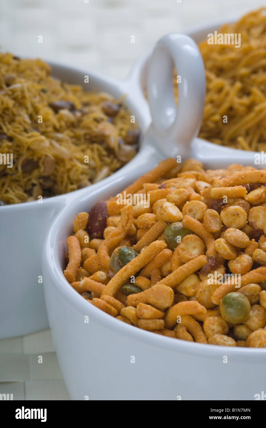 Close-up of various type of snacks in bowls Stock Photo - Alamy