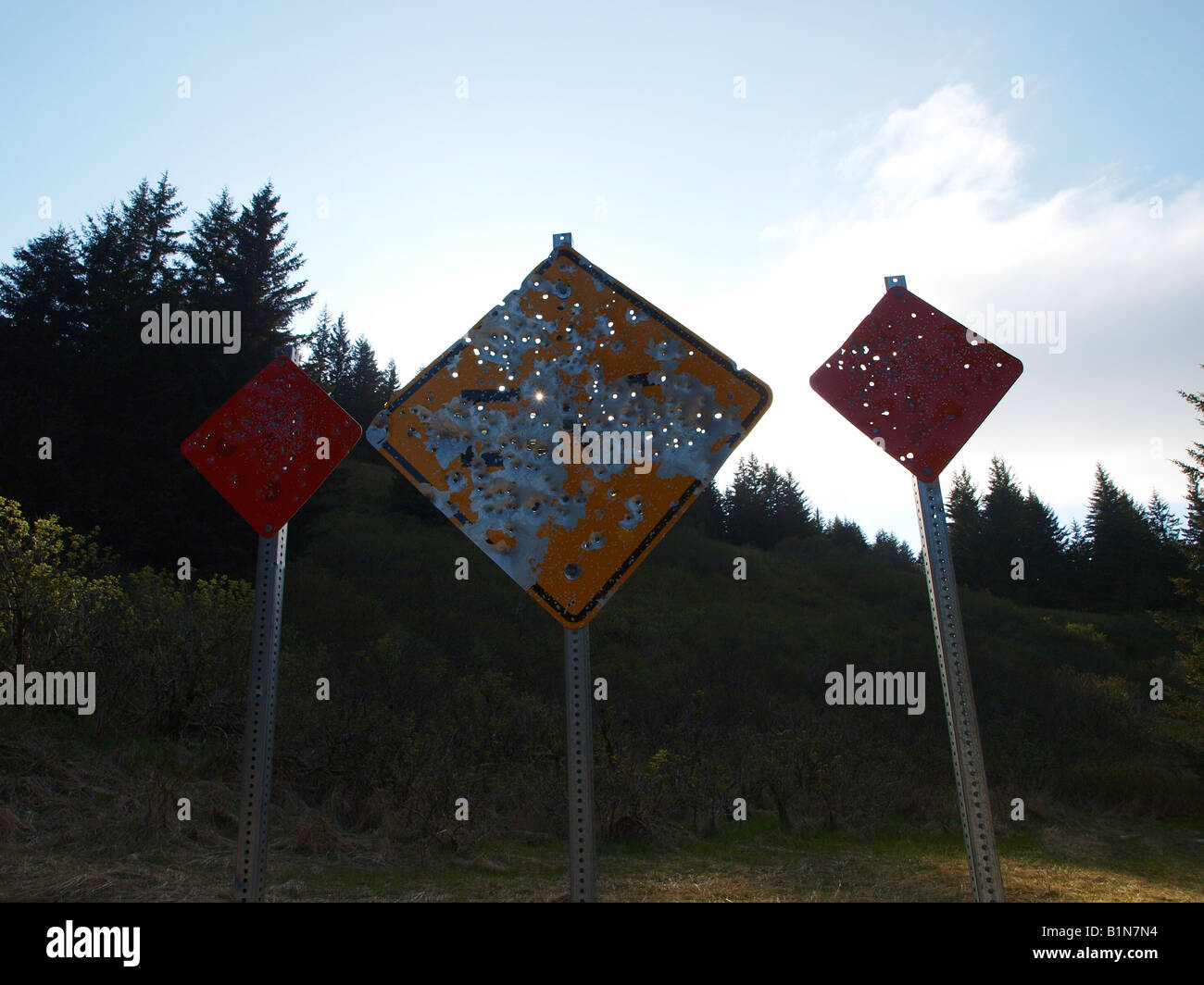 Bullet riddled road sign hi-res stock photography and images - Alamy