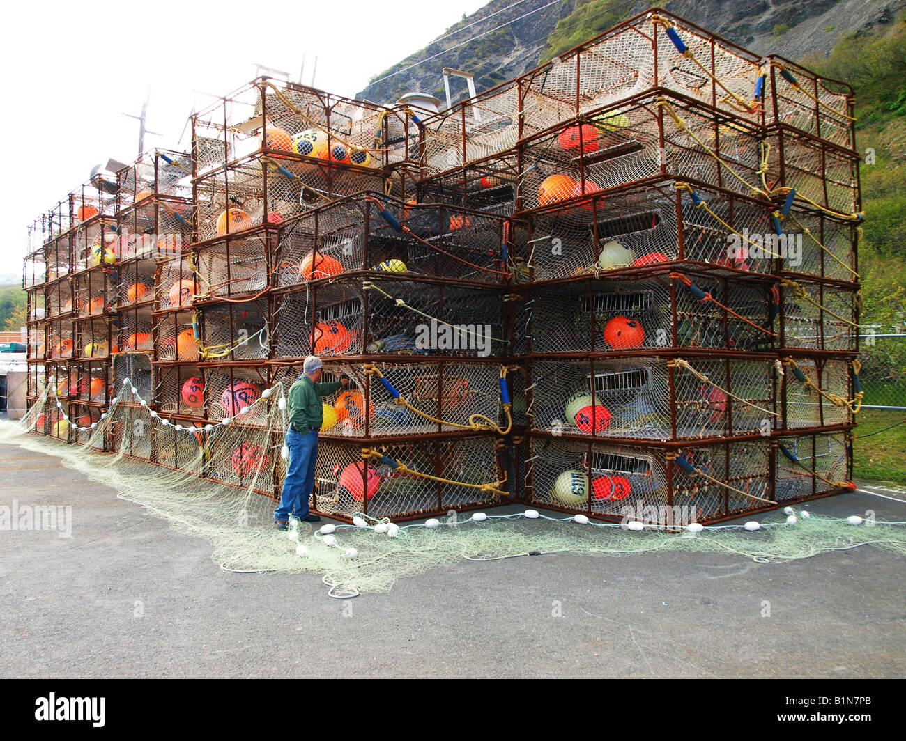 Tourist inspects crab pots, Kodiak Island Alaska Stock Photo - Alamy