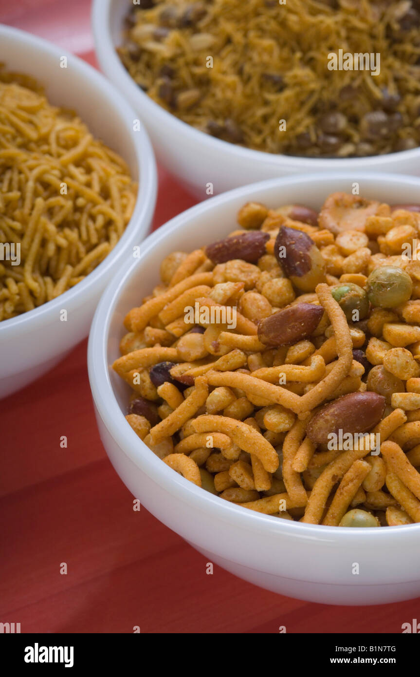 Close-up of various type of snacks in bowls Stock Photo - Alamy