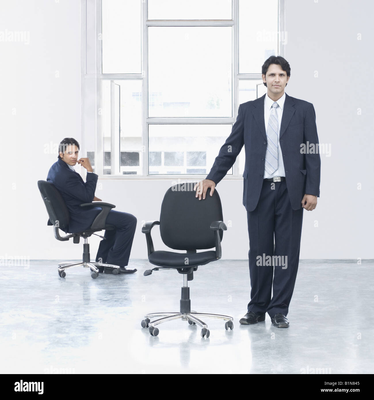 Portrait of two businessmen in an office Stock Photo - Alamy