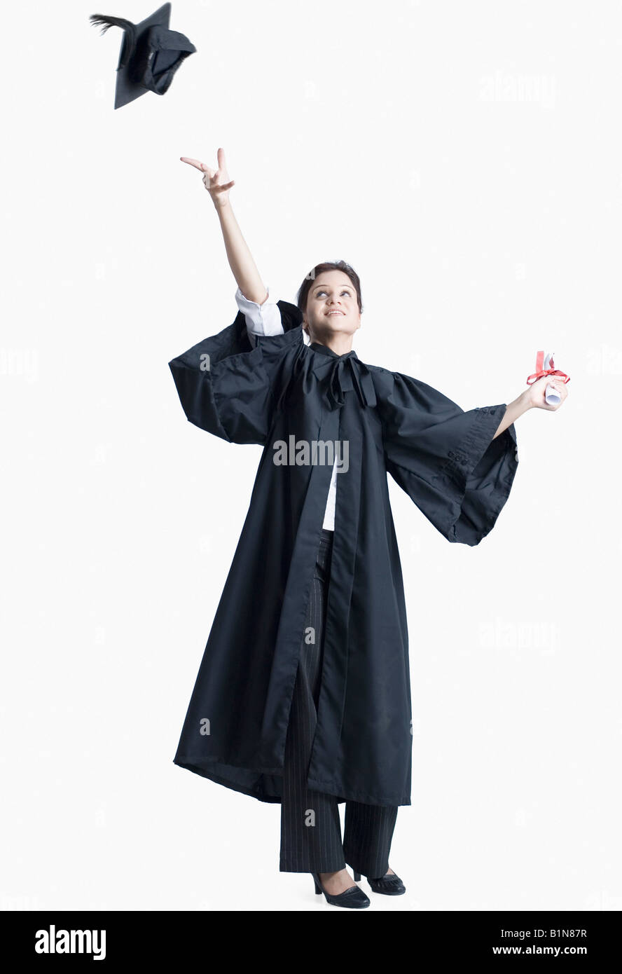 Hand throwing mortar board hi-res stock photography and images - Alamy