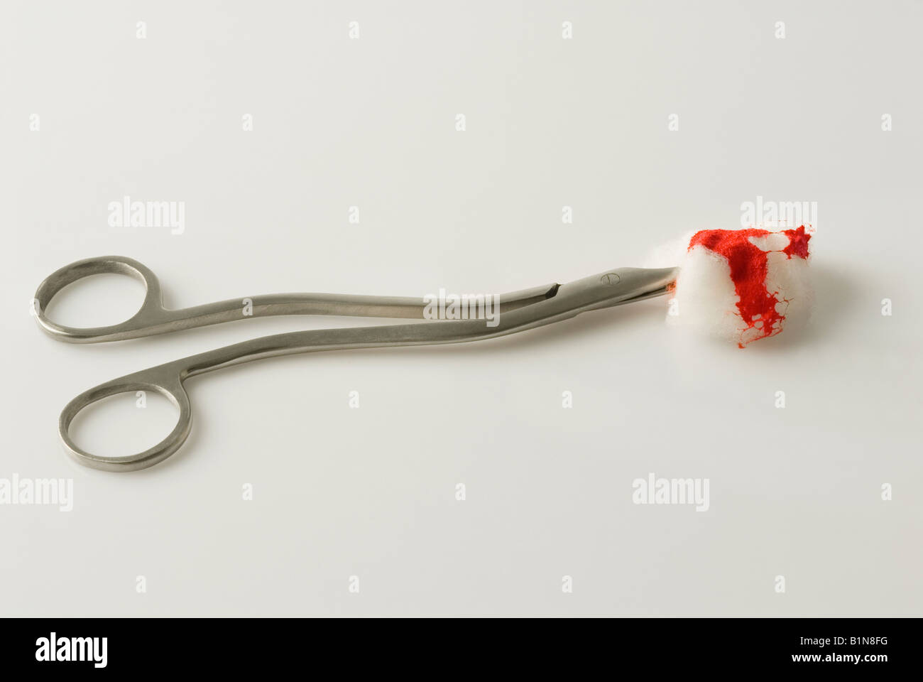 Close-up of surgical scissors with blood on cotton Stock Photo - Alamy