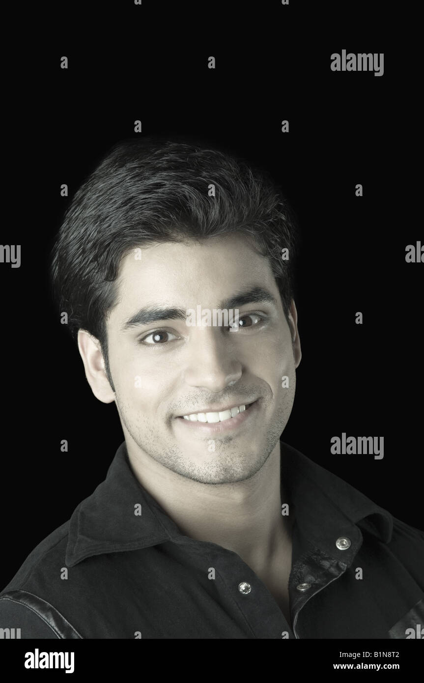 Portrait of a young man smiling Stock Photo - Alamy