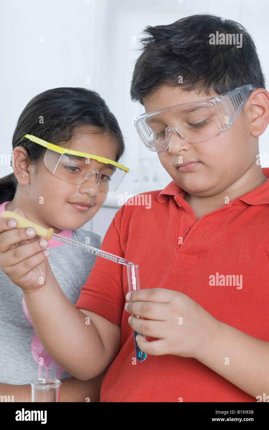 Boy girl doing scientific hi-res stock photography and images - Alamy