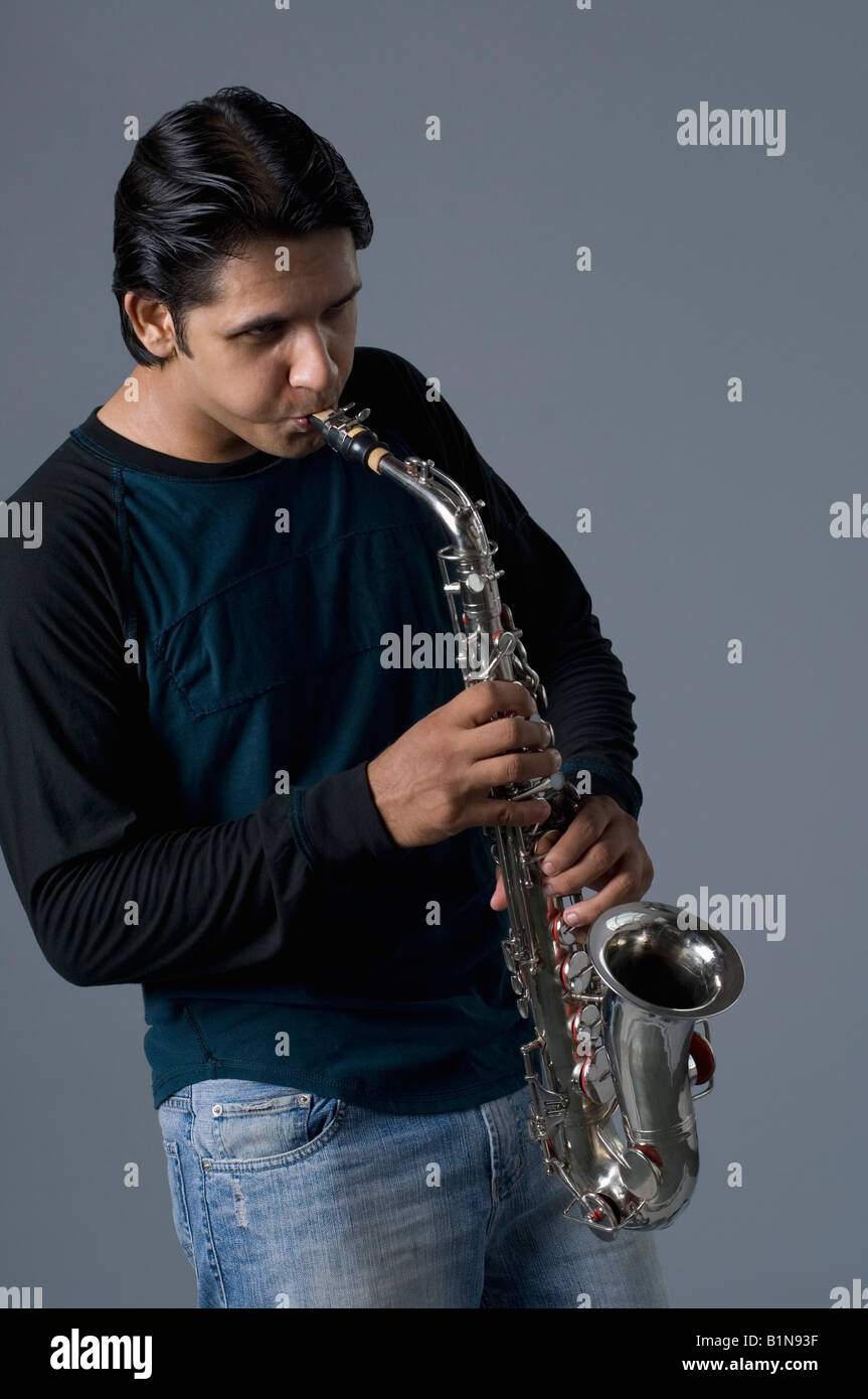 Indian man playing trumpet hi-res stock photography and images - Alamy