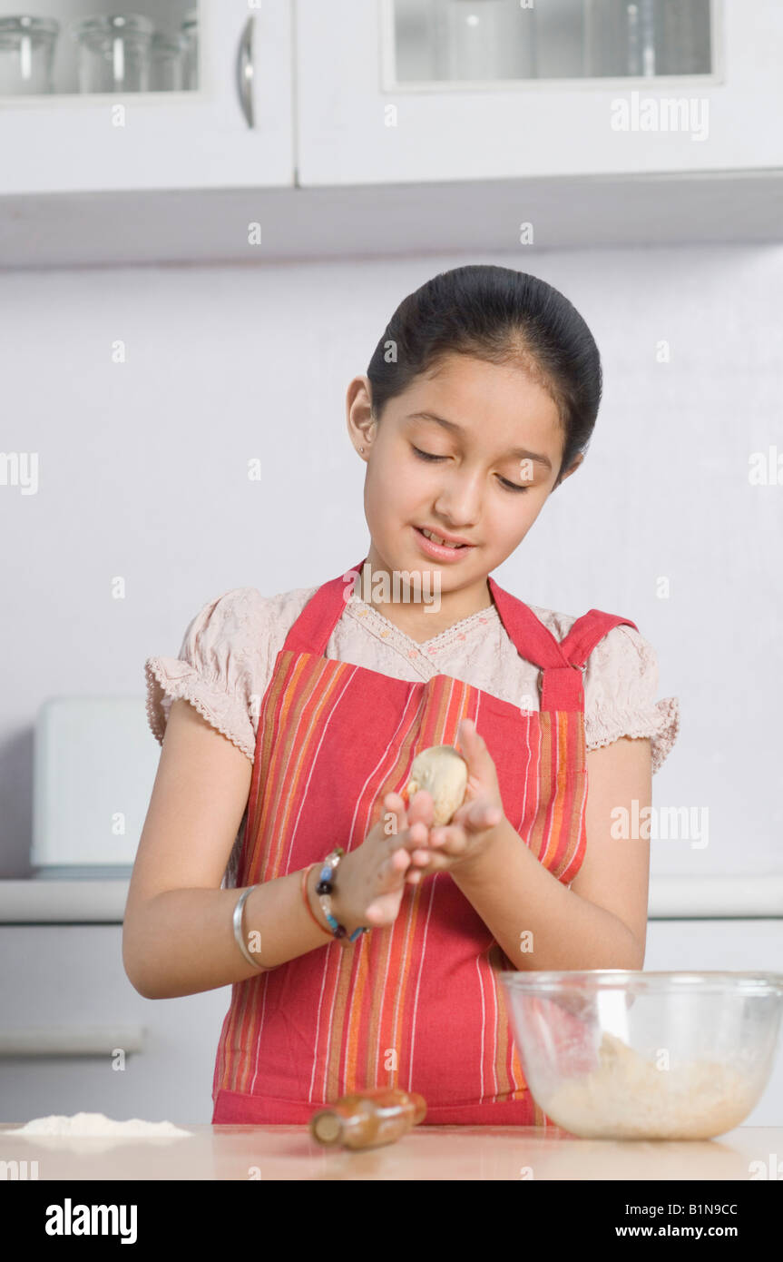 Girl preparing food in a domestic kitchen Stock Photo - Alamy
