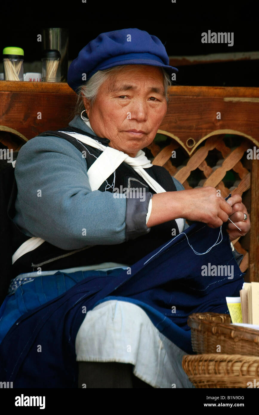Naxi woman in traditional dress, in Lijiang, Yunnan, China Stock Photo ...