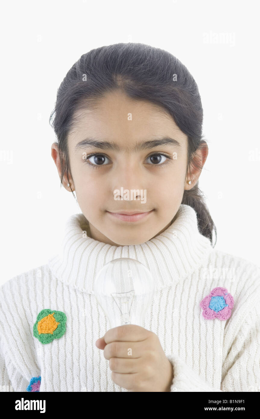 Portrait of a girl holding a light bulb Stock Photo - Alamy